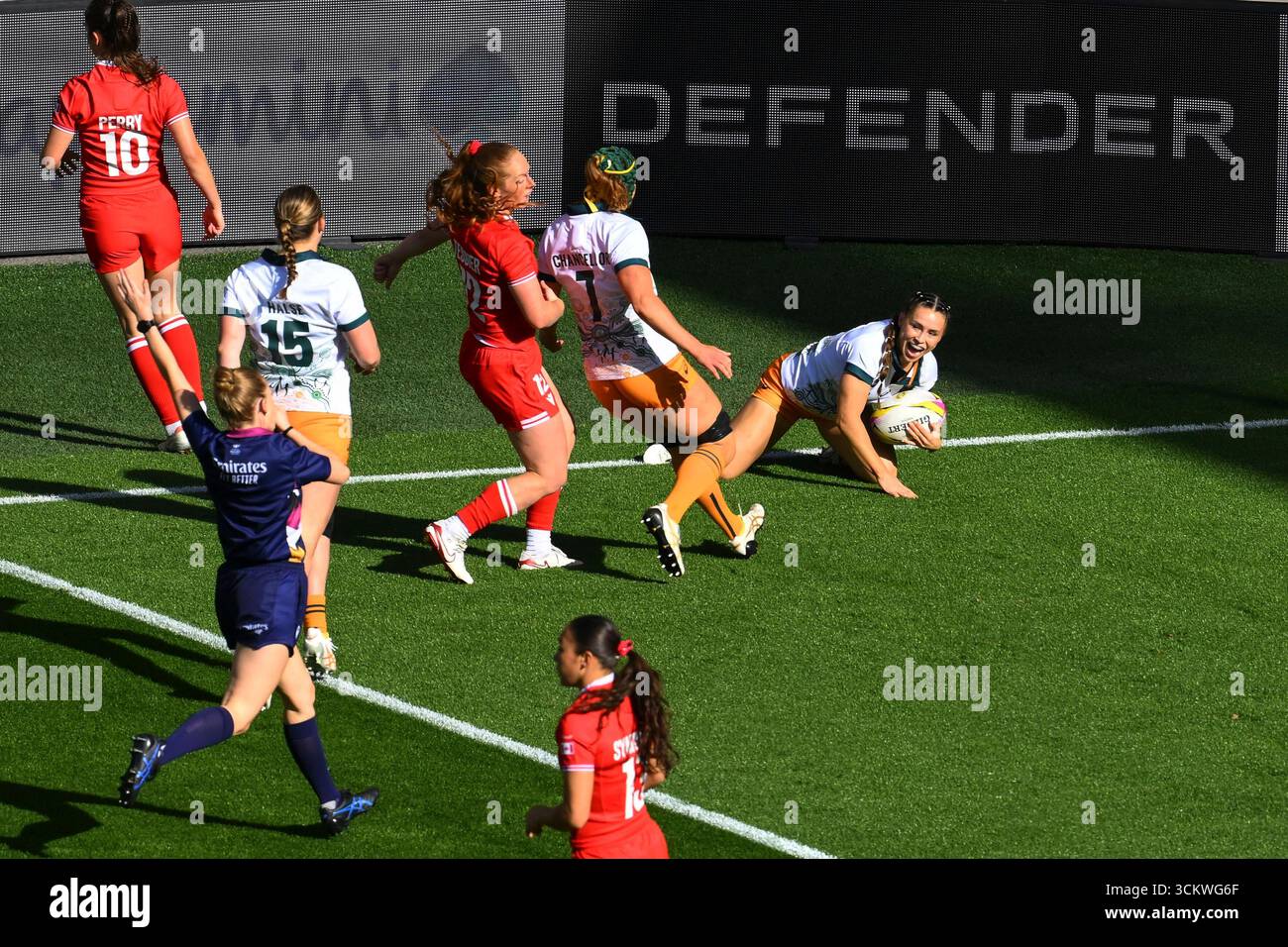 Australia's Desiree Miller, right, celebrates after scoring a try ...