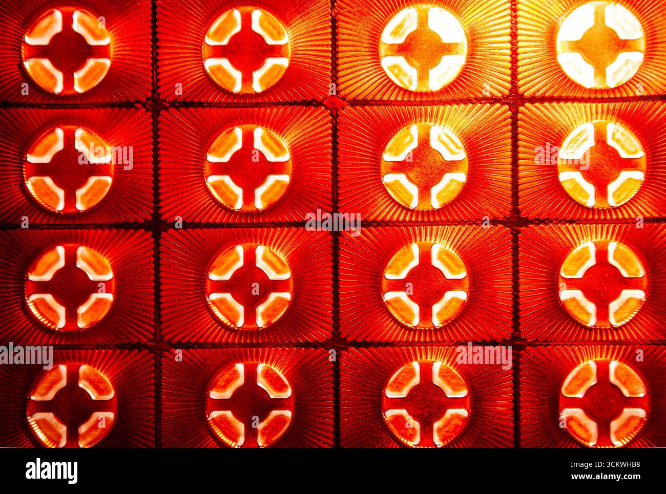 Patterns of red crosses in rectangular frames with a bright light in ...
