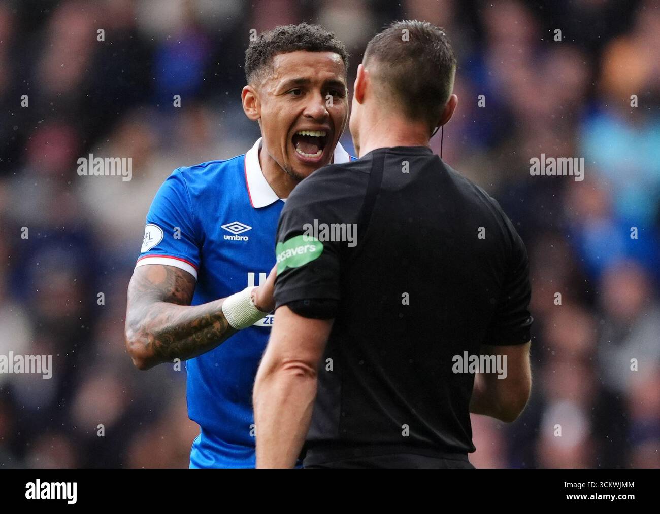 Rangers' James Tavernier (left) reacts to a decision by referee Steven ...