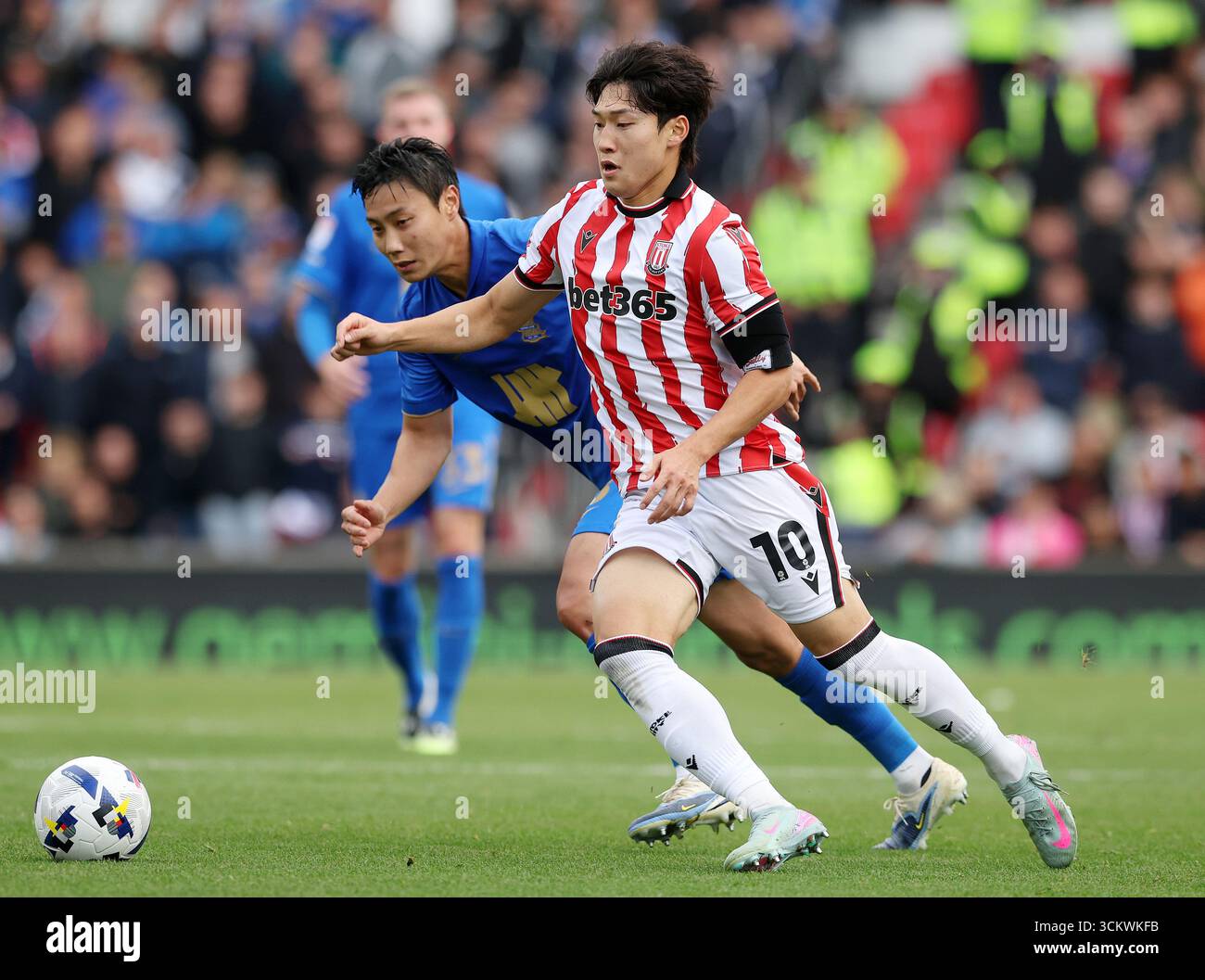 Stoke City's Bae Jun-Ho (right) and Birmingham City's Paik Seung-Ho ...