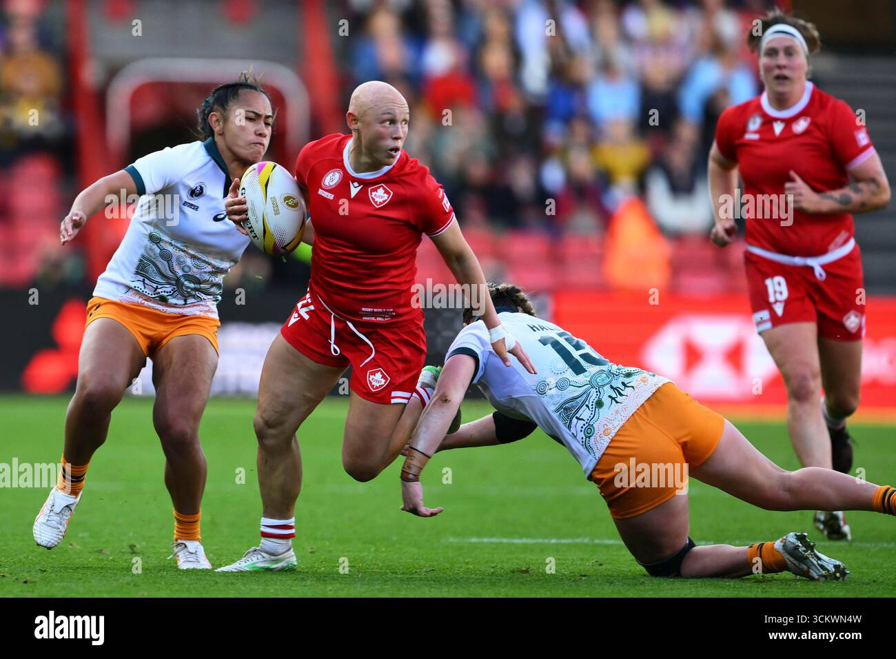 Canada's Olivia Apps, centre, is challenged by Australia's Caitlyn ...