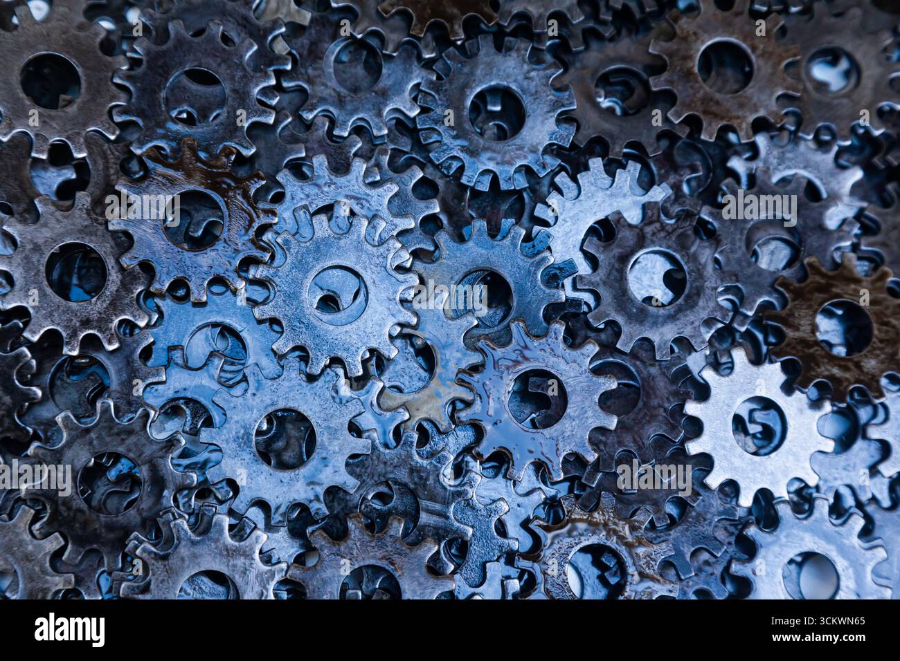 Lots of new steel gears hi-res stock photography and images - Alamy