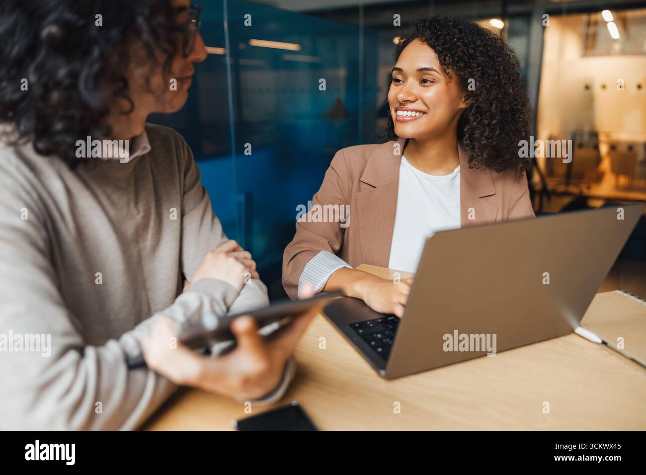 Engaging business discussion happening hi-res stock photography and ...