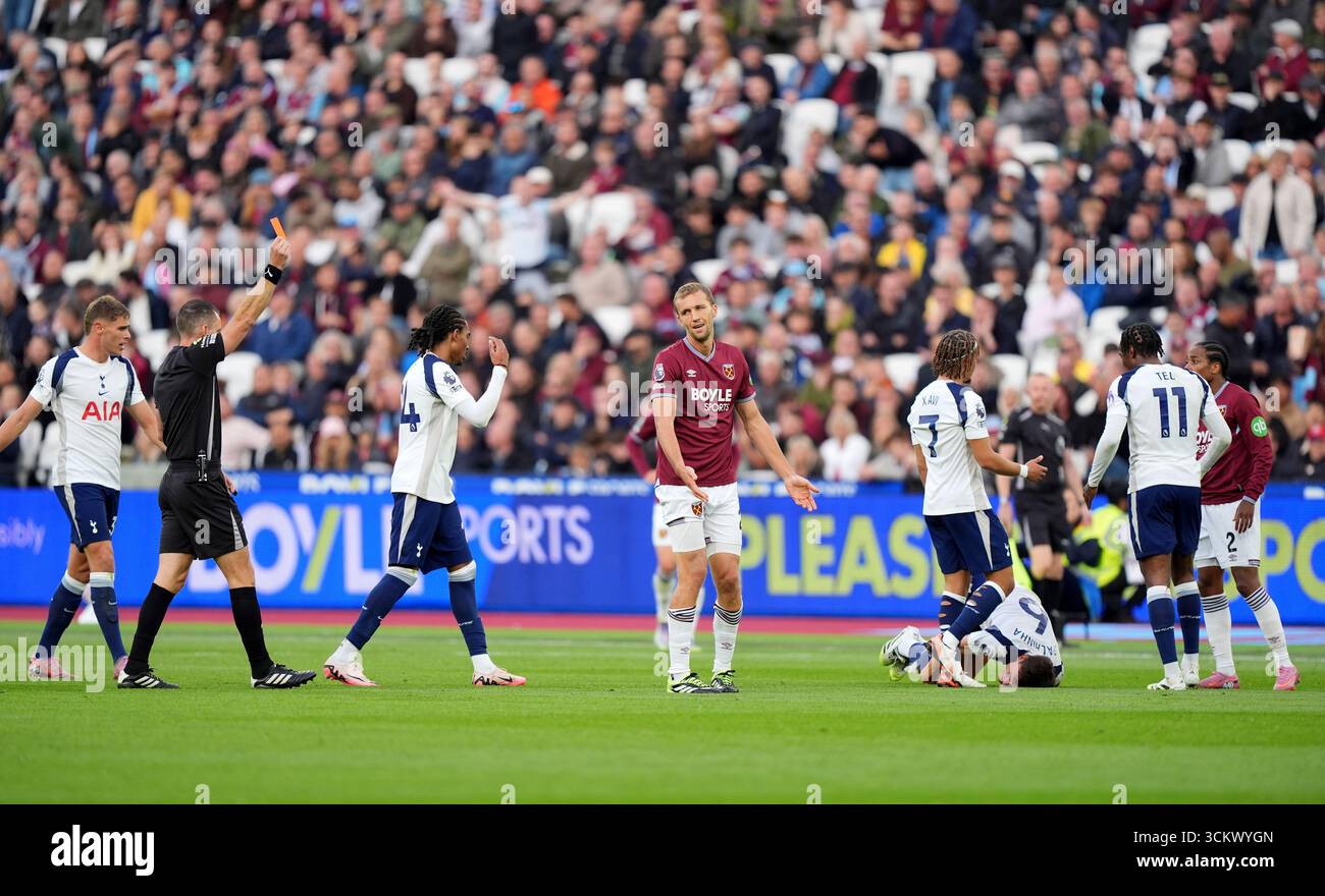 Referee Jarred Gillett (second left) shows West Ham United's Tomas ...