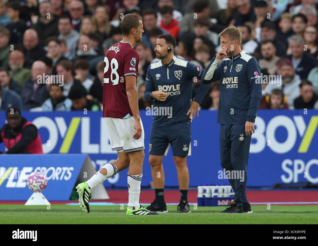 West Ham United's Tomas Soucek leaves the game and passes manager ...