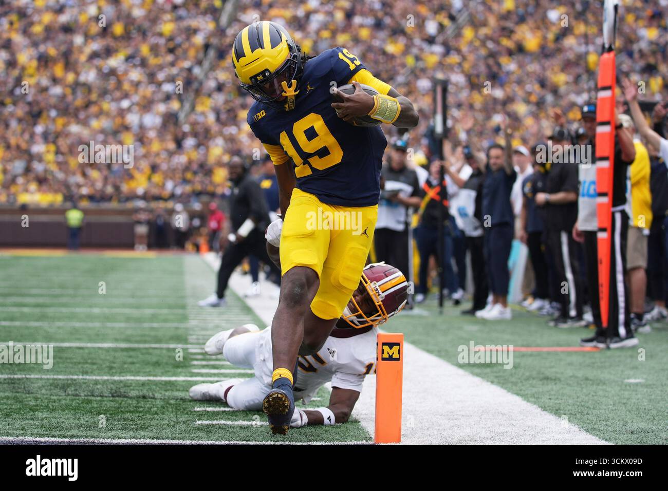 Michigan quarterback Bryce Underwood, front, scores a touchdown against ...
