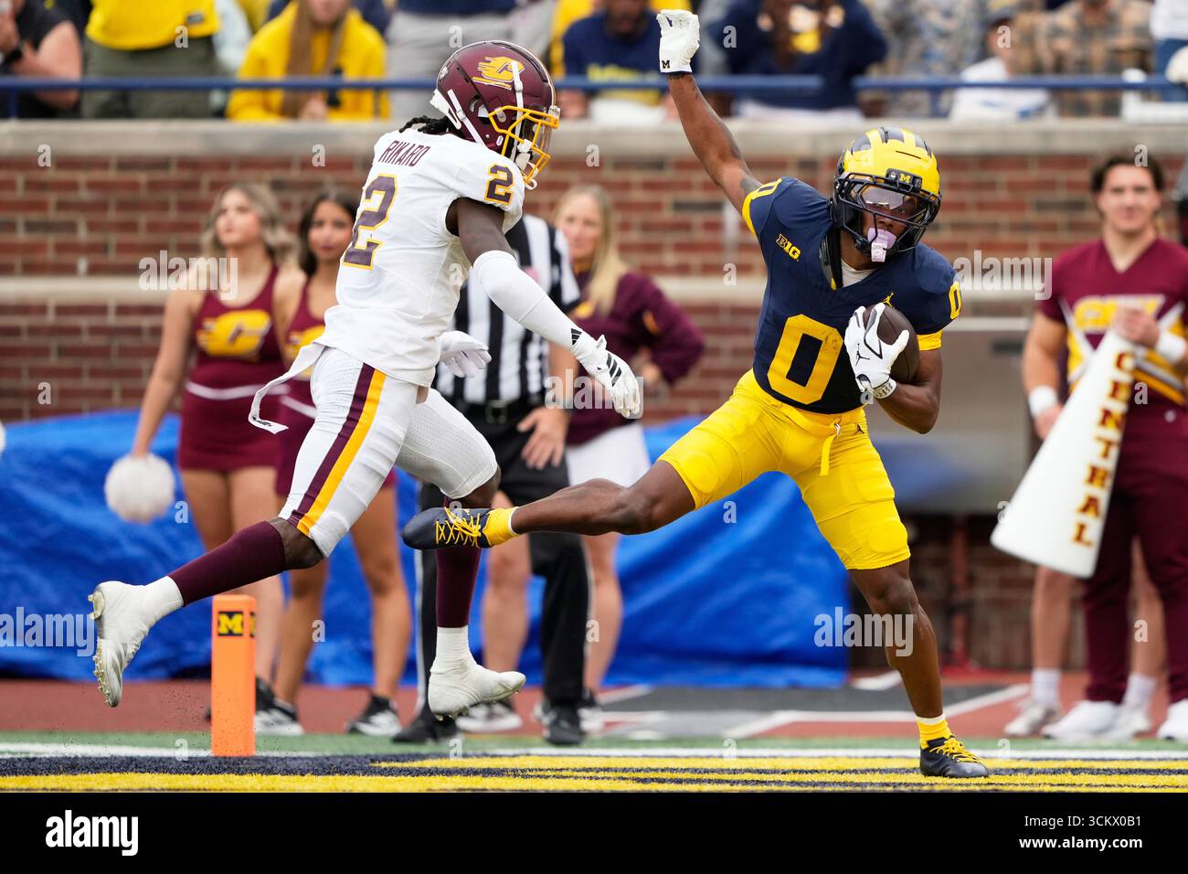 Michigan wide receiver Semaj Morgan, right, scores a touchdown past Central Michigan defensive ...
