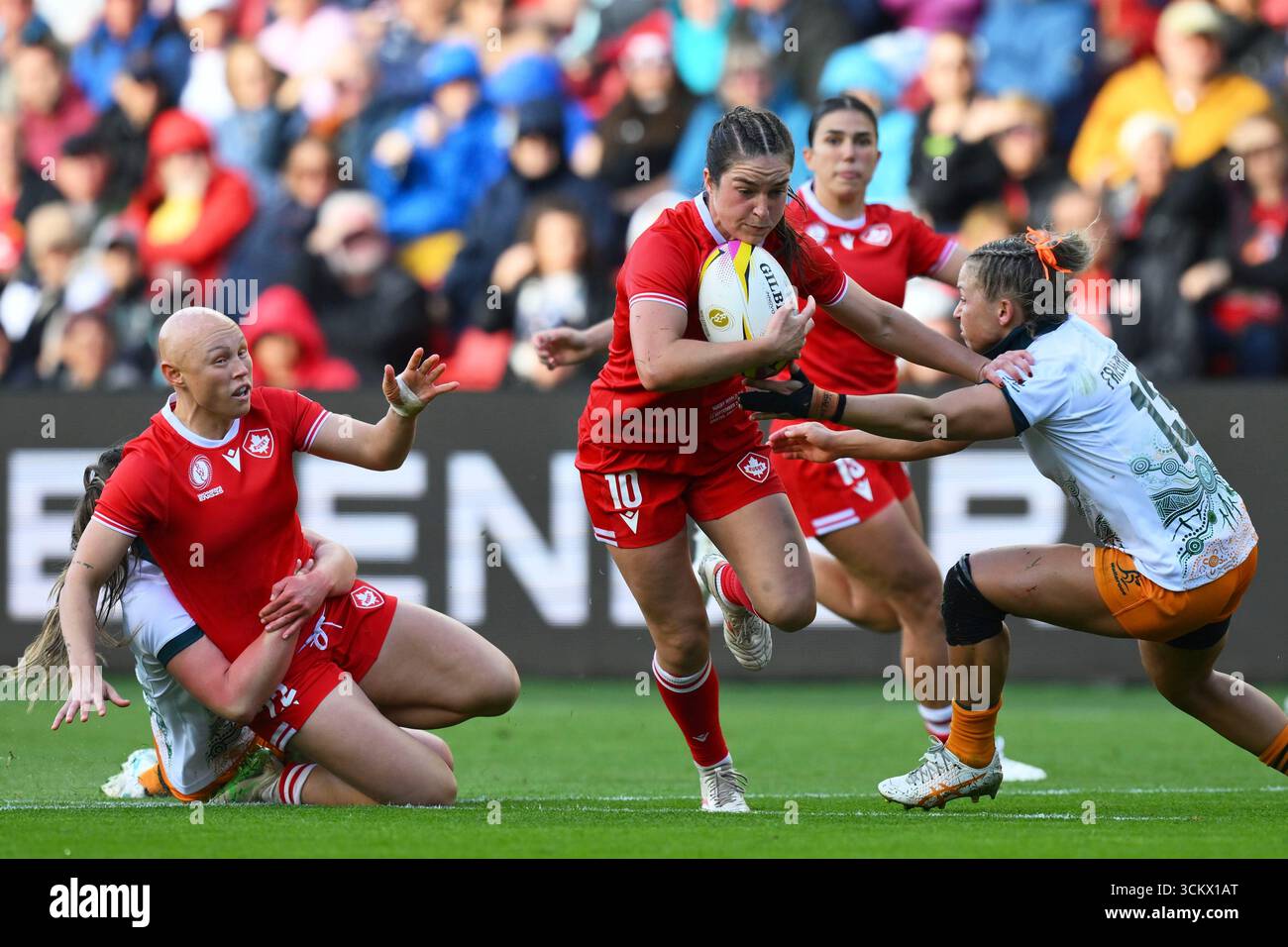 Canada's Taylor Perry, center, challenged by Australia's Georgina ...