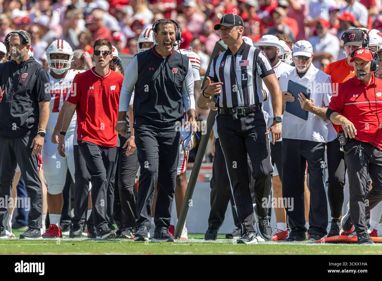 Wisconsin head coach Luke Fickell talks with a referee during the first ...