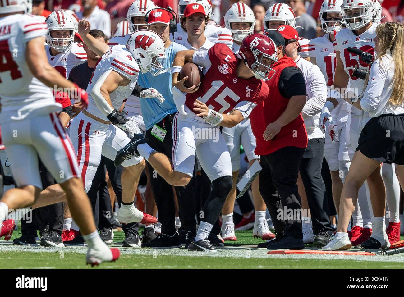 Alabama quarterback Ty Simpson (15) runs the ball past Wisconsin ...