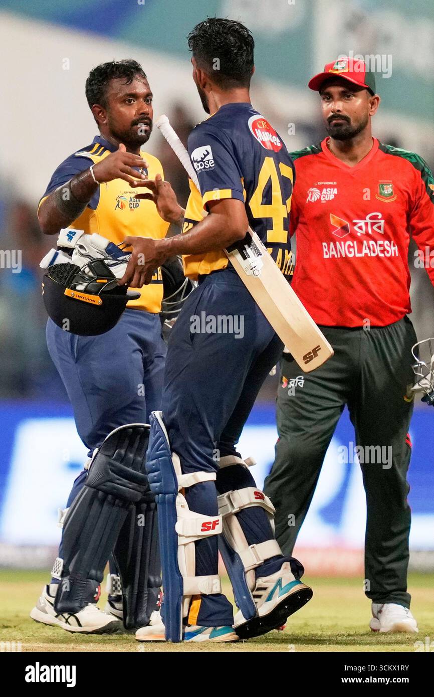 Sri Lanka's captain Charith Asalanka, left, and teammate Kamil Mishara ...