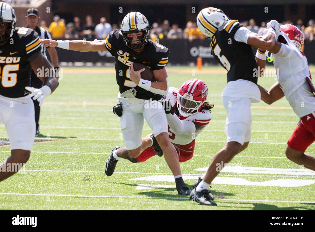 Missouri's Beau Pribula, left, is tackled by Louisiana-Lafayette ...