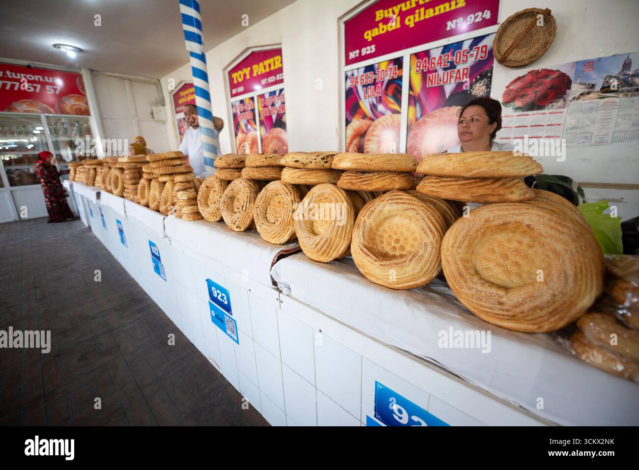 Traditional round loaves of bread for sale within the Chorsu market ...