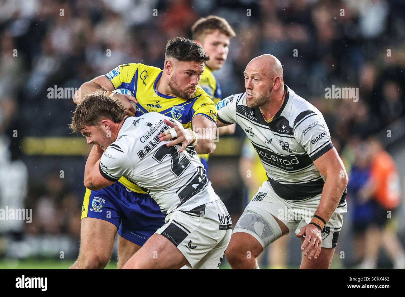 Joe Philbin of Warrington Wolves is tackled during the Betfred Super ...