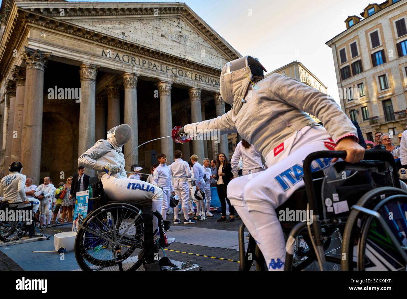 Italian Paralympian fencer Loredana Trigilia, right, engages with ...