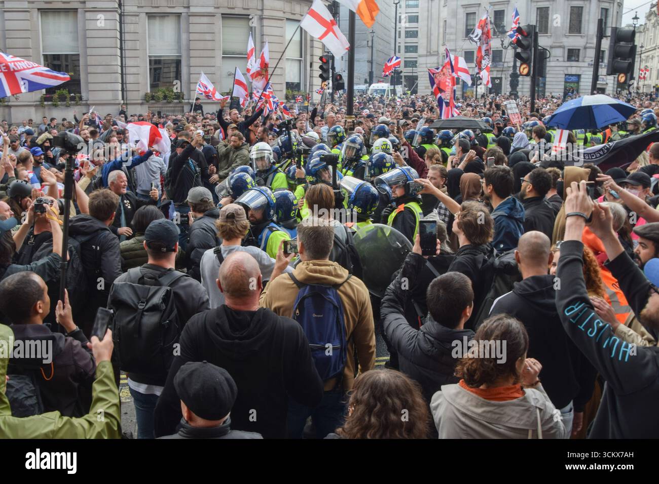 London, UK. 13th September 2025. Riot police keep far-right protesters ...