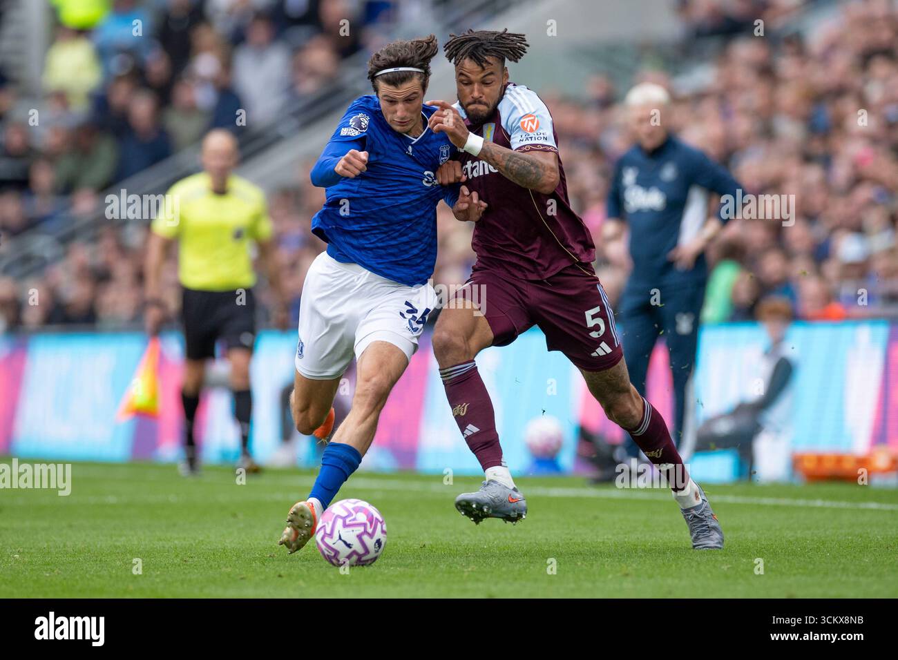 Merlin Rohl #34 of Everton F.C. in a tussle with Tyrone Mings #5 of ...