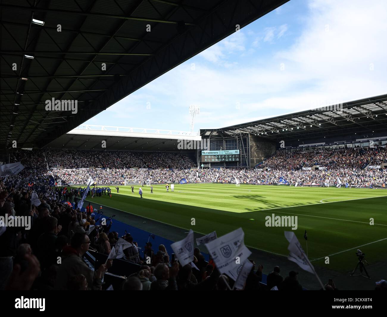 Birmingham, UK. 13th September 2025. Fans wave special 125th Anniversary Flags before the match ...