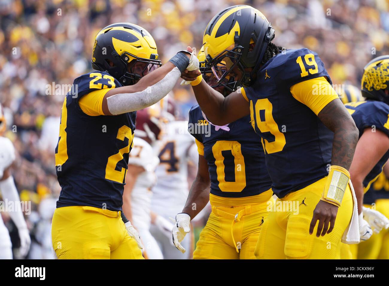 Michigan running back Jordan Marshall, left, celebrates his touchdown ...