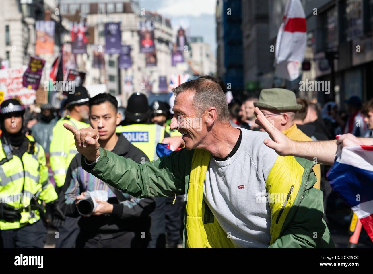 London, UK. 13 September, 2025. Far-right nationalists taunt a passing ...