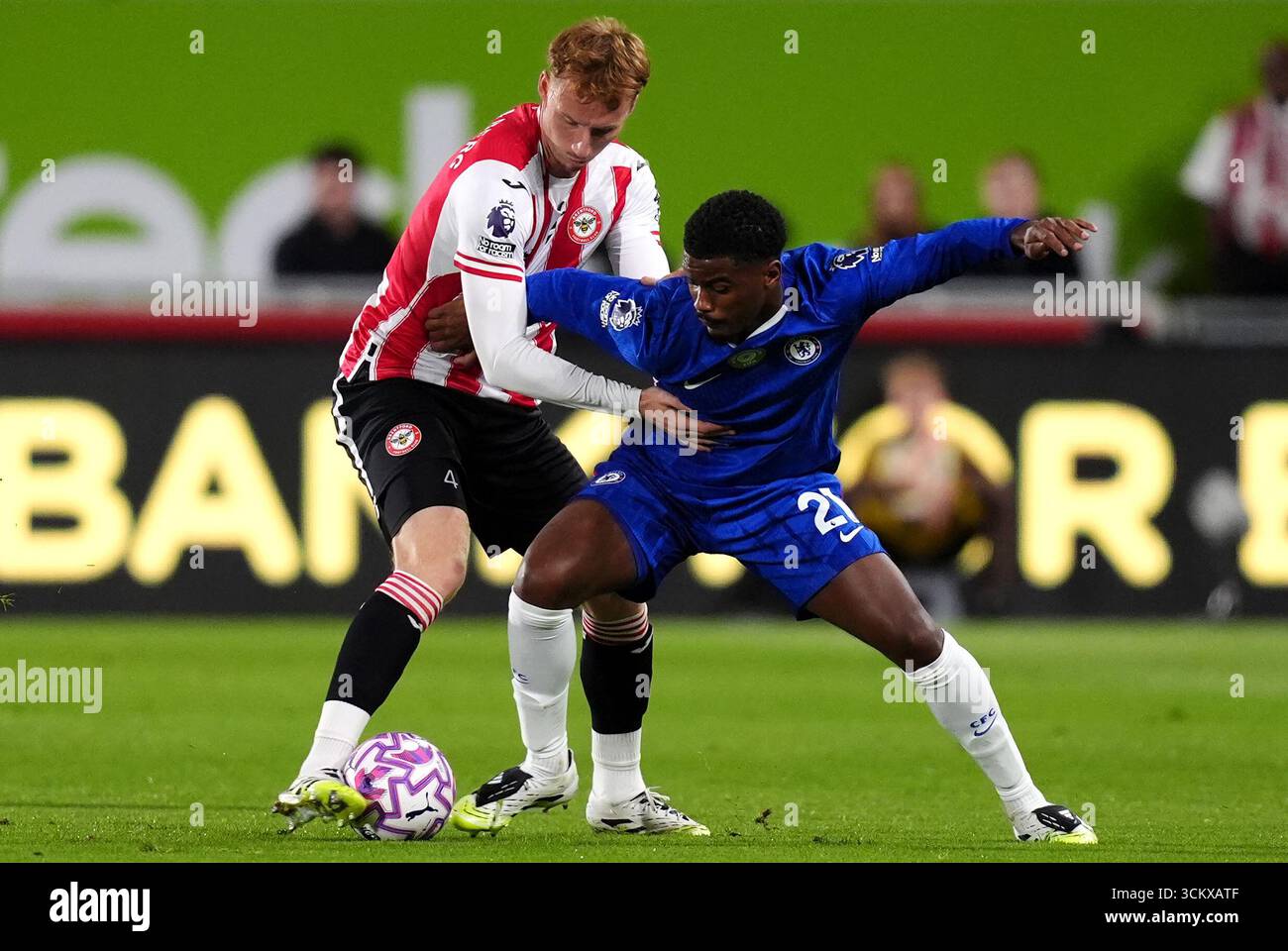 Brentford's Sepp van den Berg (left) and Chelsea's Jorrel Hato battle ...