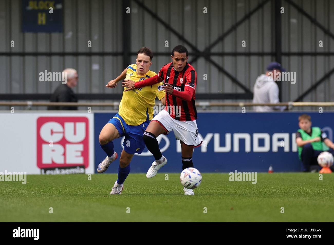 SOLIHULL, UK. 13TH SEPTEMBER 2025. Miguel Azeez of Morecambe and Jacob ...