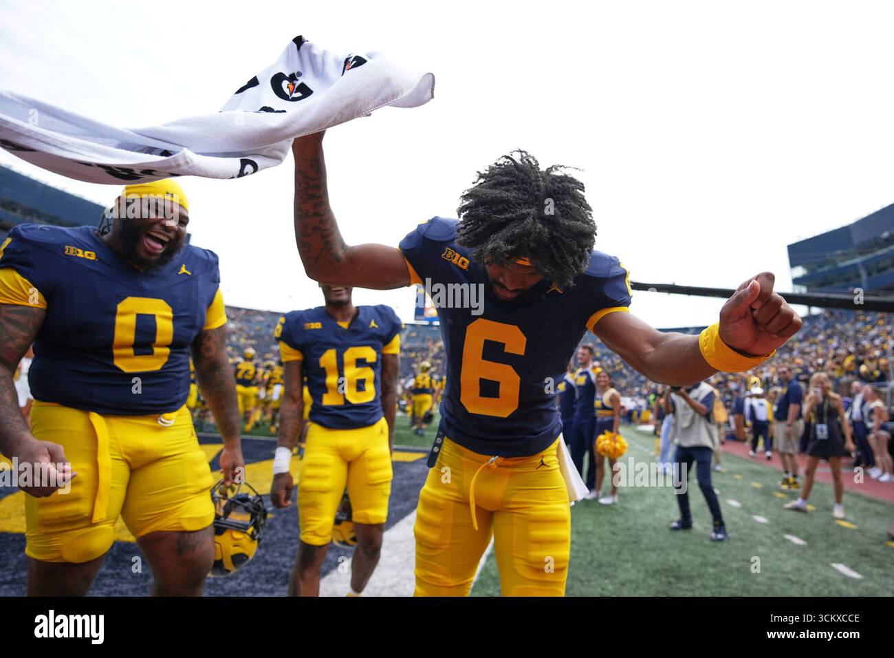 Michigan defensive back Brandyn Hillman, right, dances next to ...