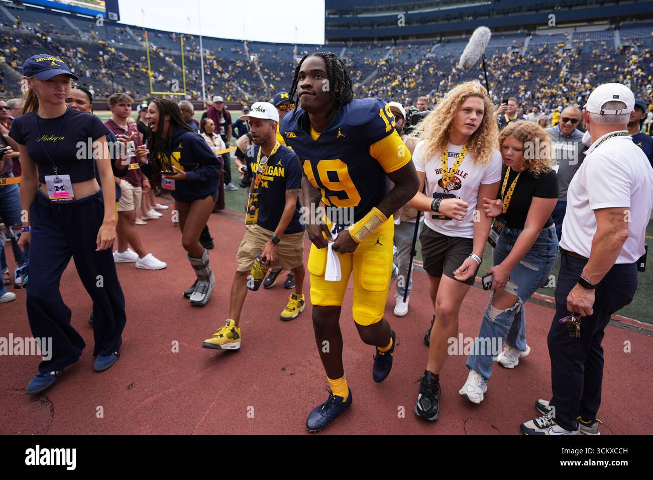 Michigan quarterback Bryce Underwood walks off the field during the ...