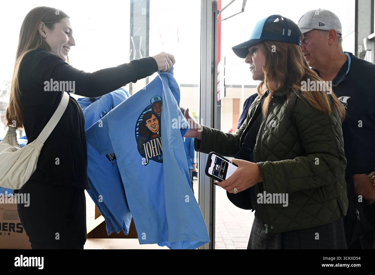 Toronto Argonauts fans receive a commemorative t-shirt remembering late ...
