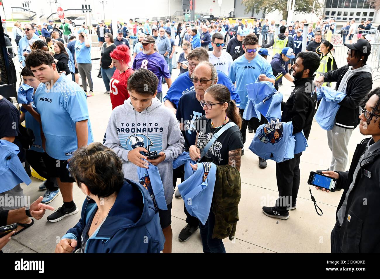 Toronto Argonauts fans receive a commemorative t-shirt remembering late ...