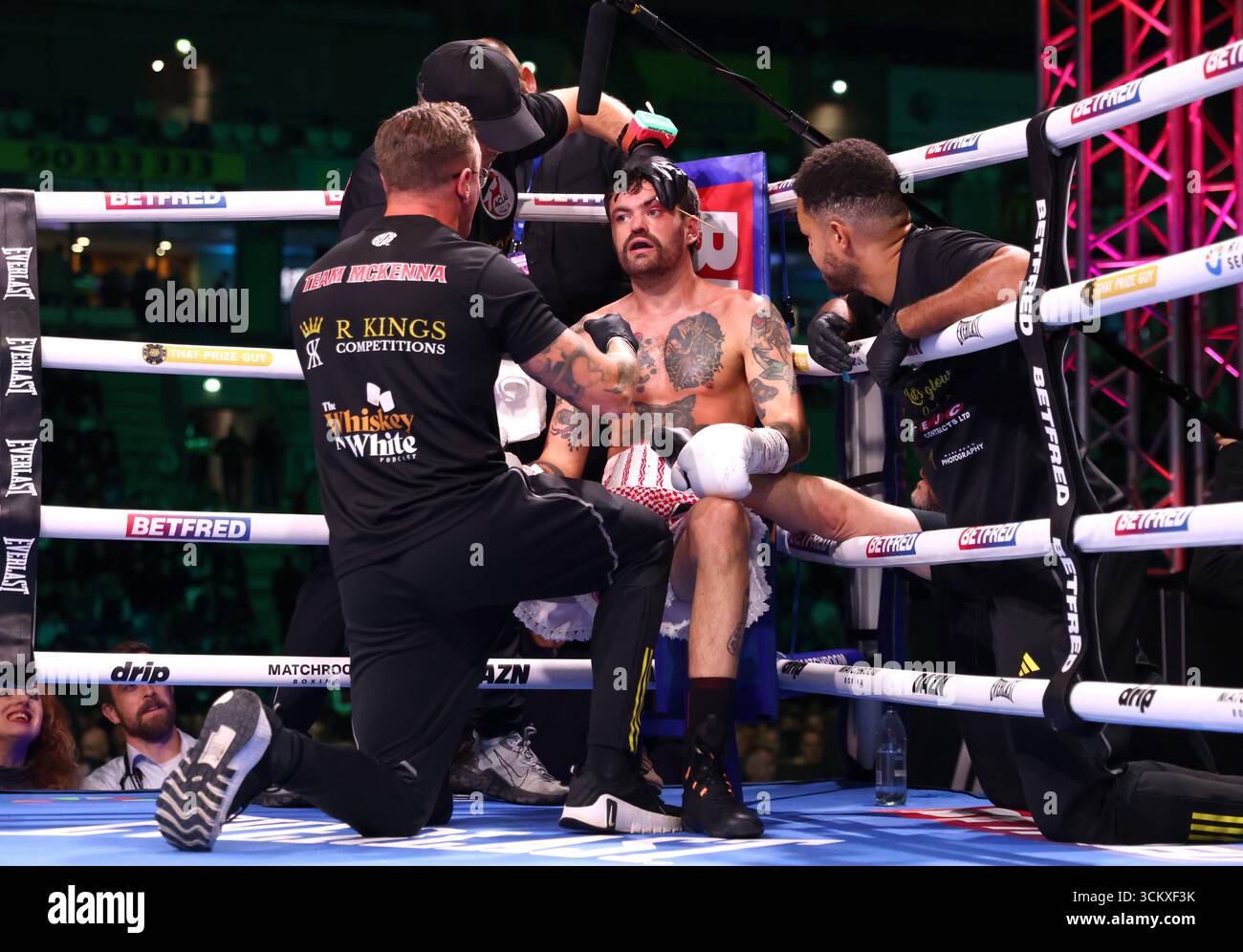 Tyrone McKenna (centre) in his corner during his fight against Dylan Moran in the welter weight ...