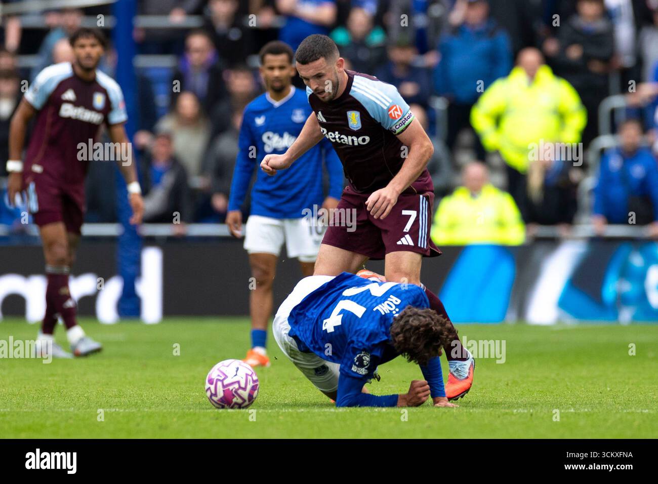 John McGinn #7 of Aston Villa F.C fouls Merlin Rohl #34 of Everton F.C ...