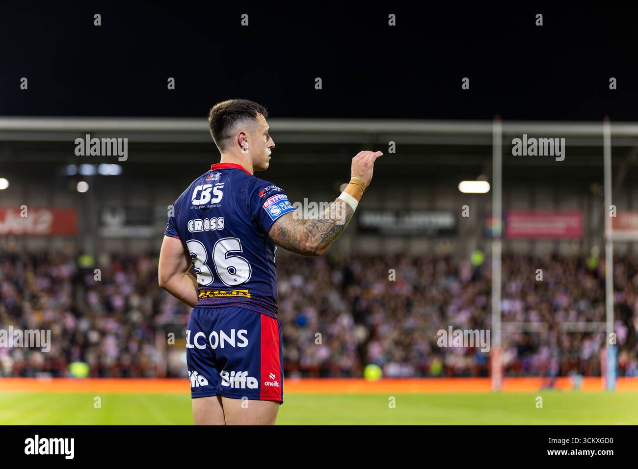 Deon Cross of St Helens discusses tactics with teammates during the ...