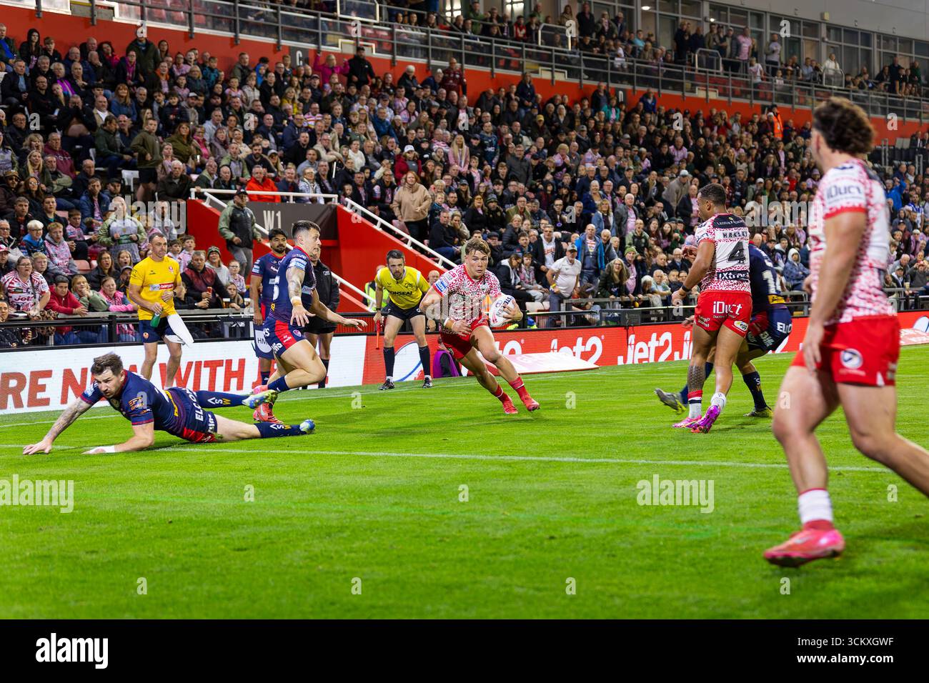 Keanan Brand of Leigh Leopards looks to find a gap in the St Helens ...