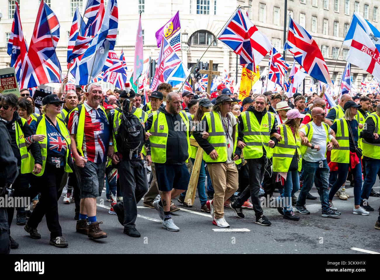 'Unite the Kingdom' march led by Tommy Robinson gathers hundreds of ...