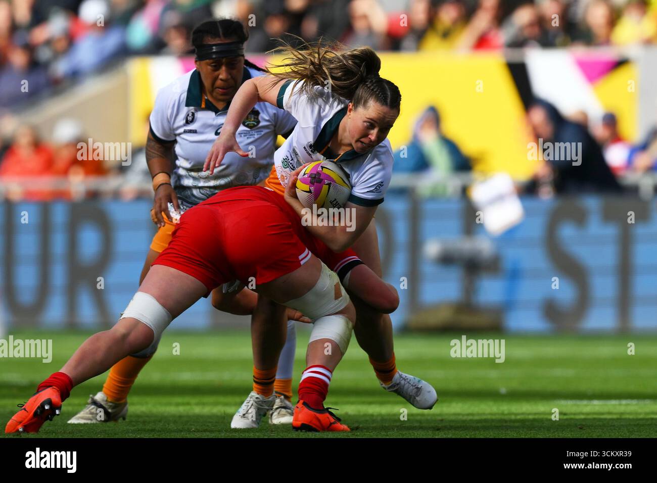 Canada's Olivia Apps, right, is tackled by Canada's Sophie de Goede ...