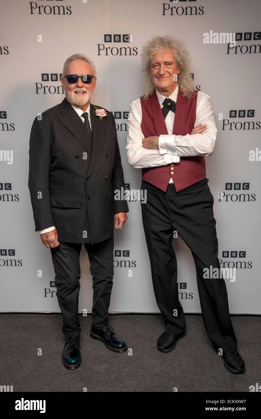 Roger Taylor (left) and Sir Brian May from Queen pose backstage at the ...