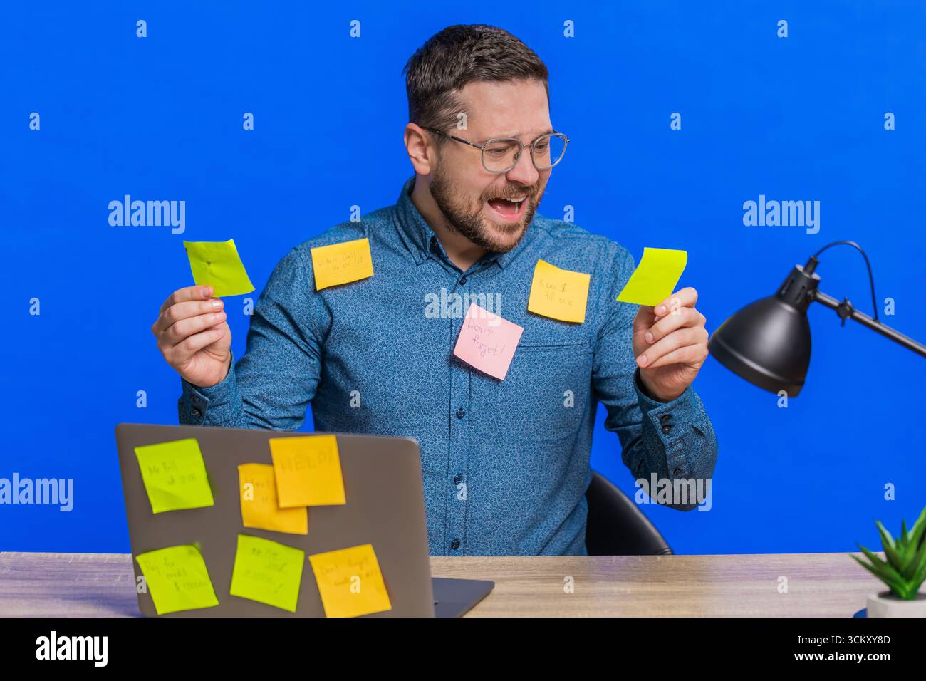Exhausted man sitting table pasted hi-res stock photography and images ...