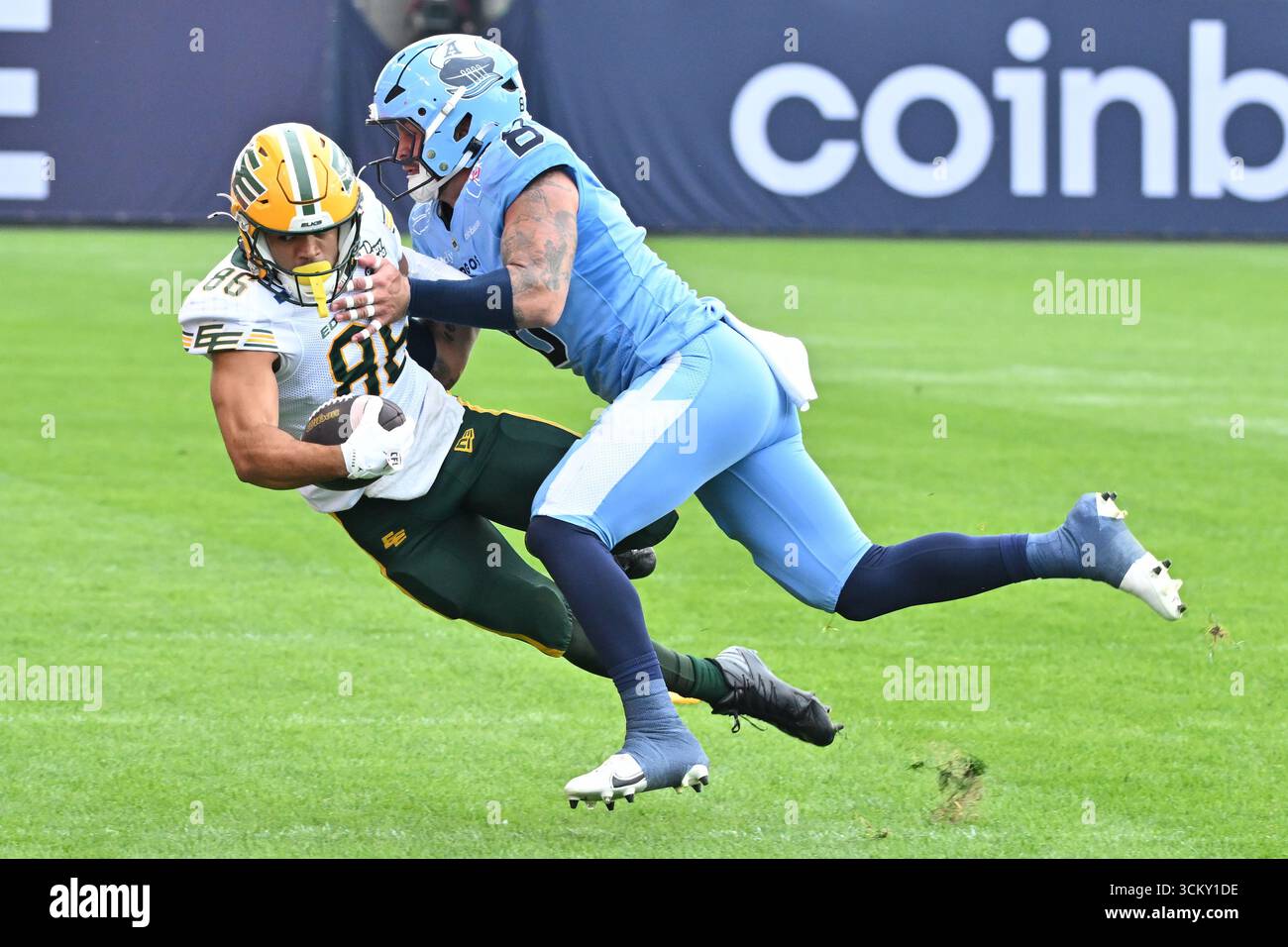 Edmonton Elks' wide receiver Arkell Smith (86) is tackled by Toronto ...