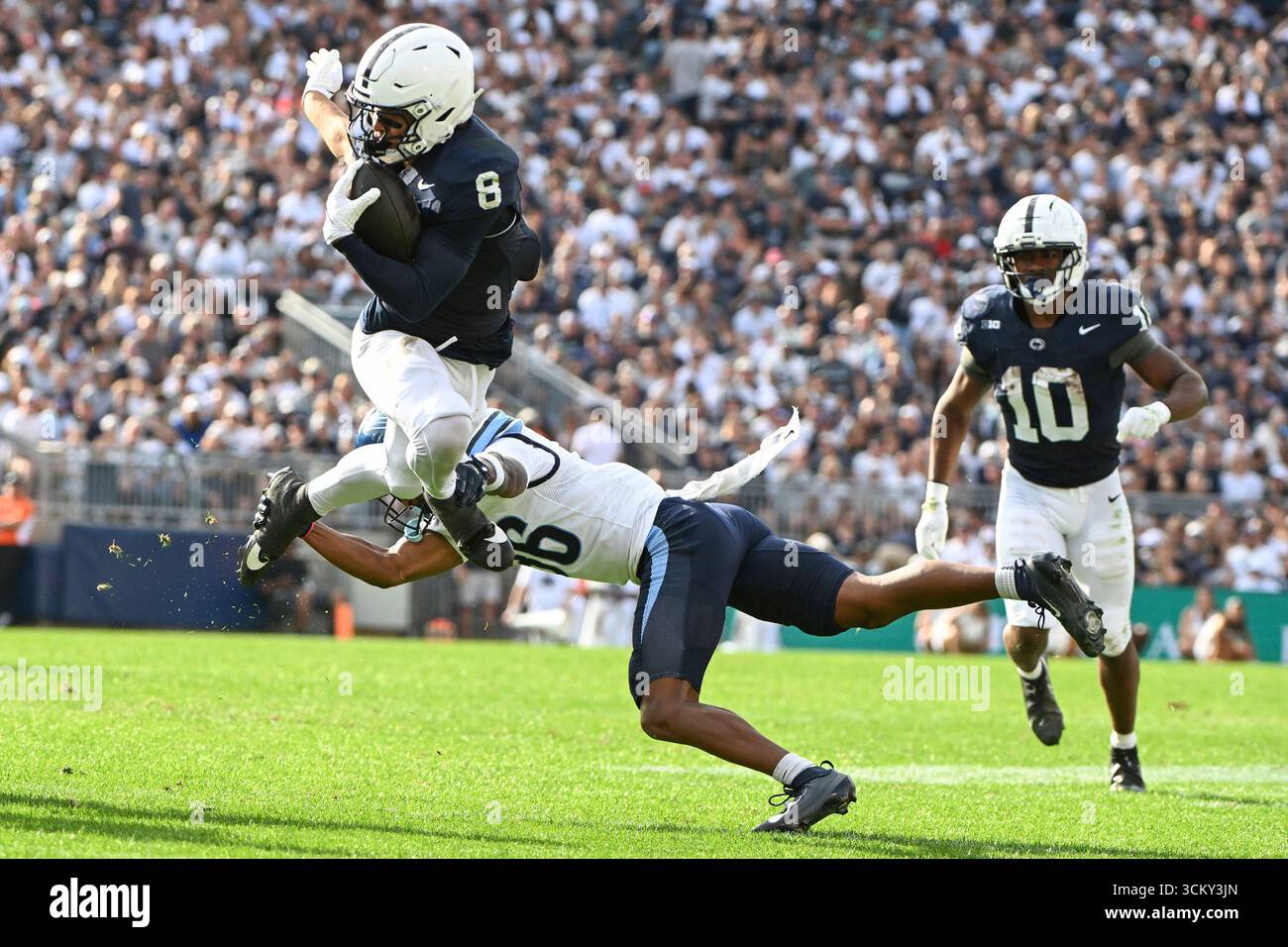 Penn State wide receiver Trebor Pena (8) hurdles Villanova cornerback ...