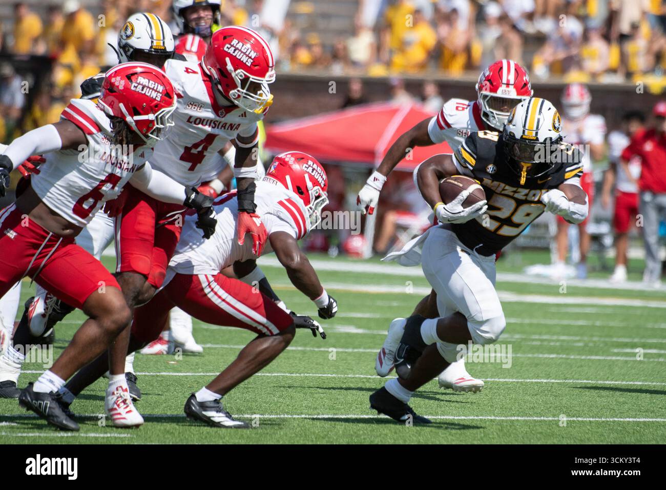 Missouri running back Ahmad Hardy, right, runs past Louisiana-Lafayette ...
