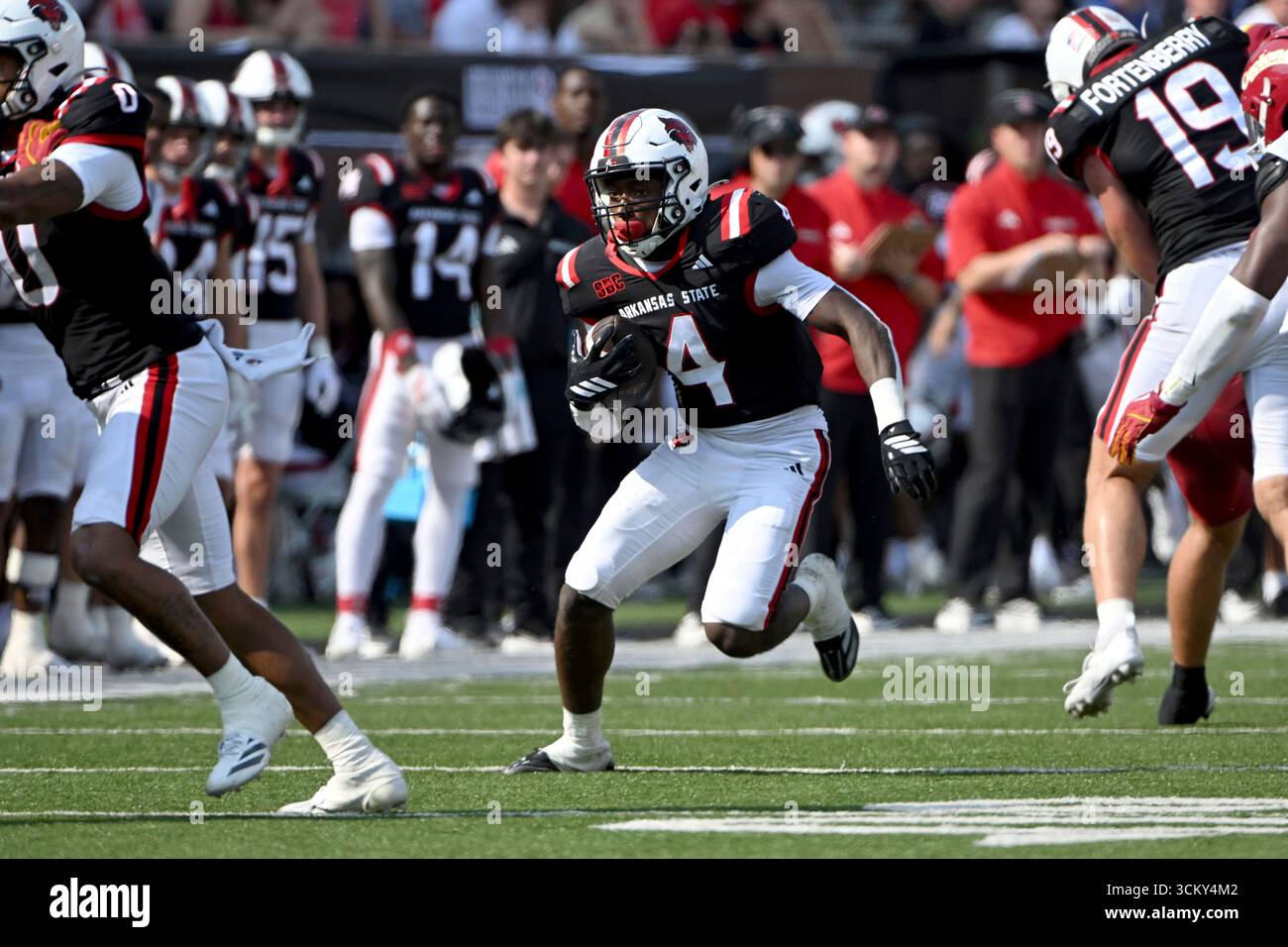 Arkansas State running back Devin Spencer (4) runs for a gain against ...
