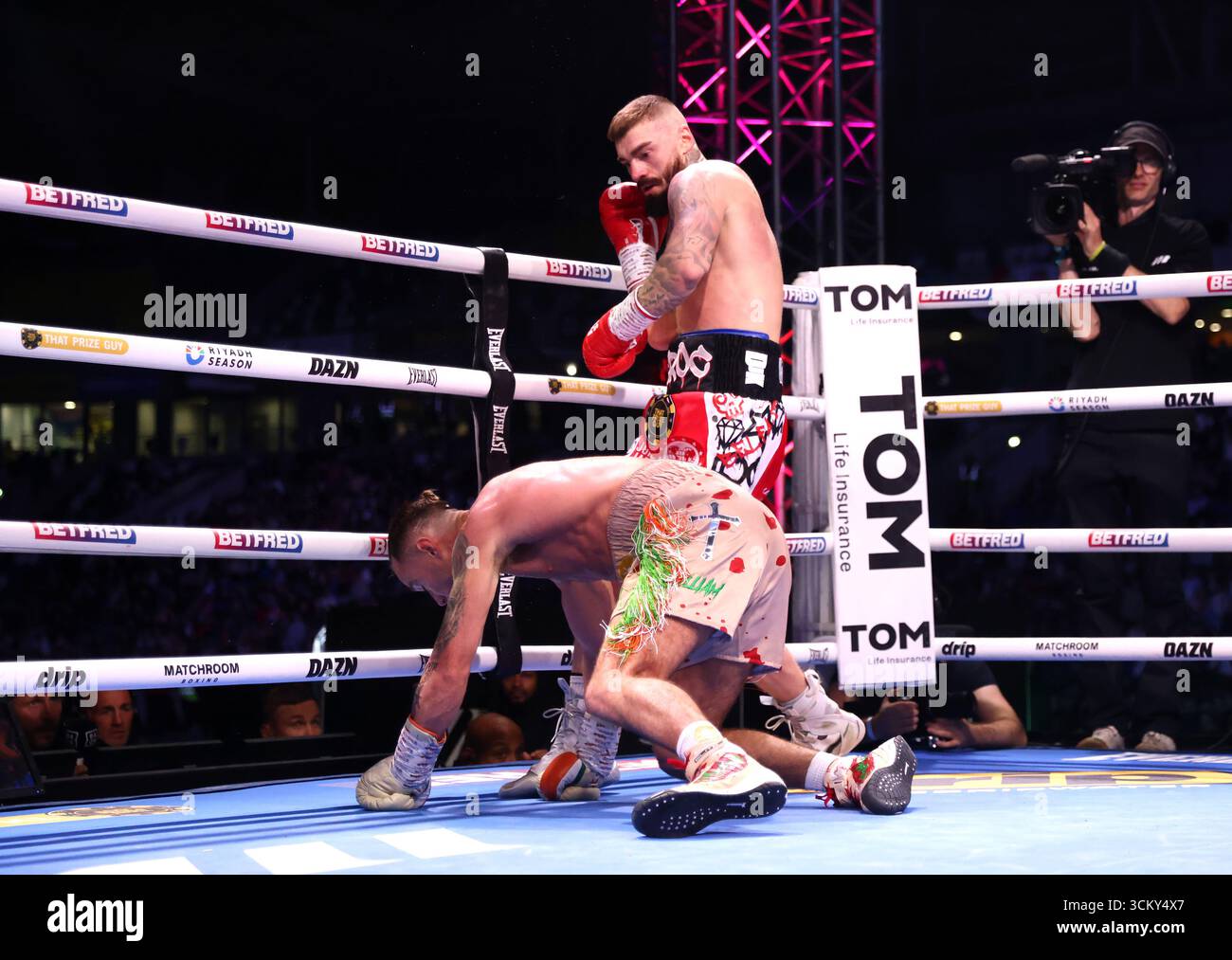 Lewis Crocker (right) knocks down Paddy Donovan in the vacant IBF World ...