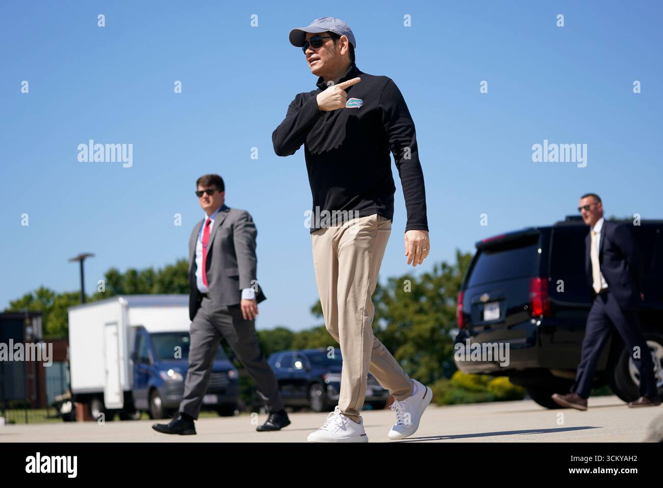 Secretary of State Marco Rubio walks on the tarmac on before departing ...