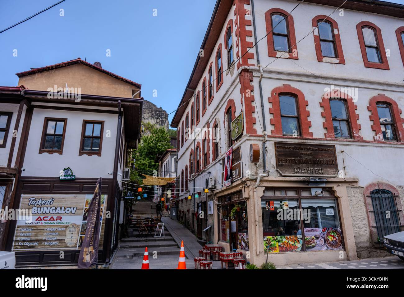A street view with shops and the Pertev Naili Boratav Culture House ...