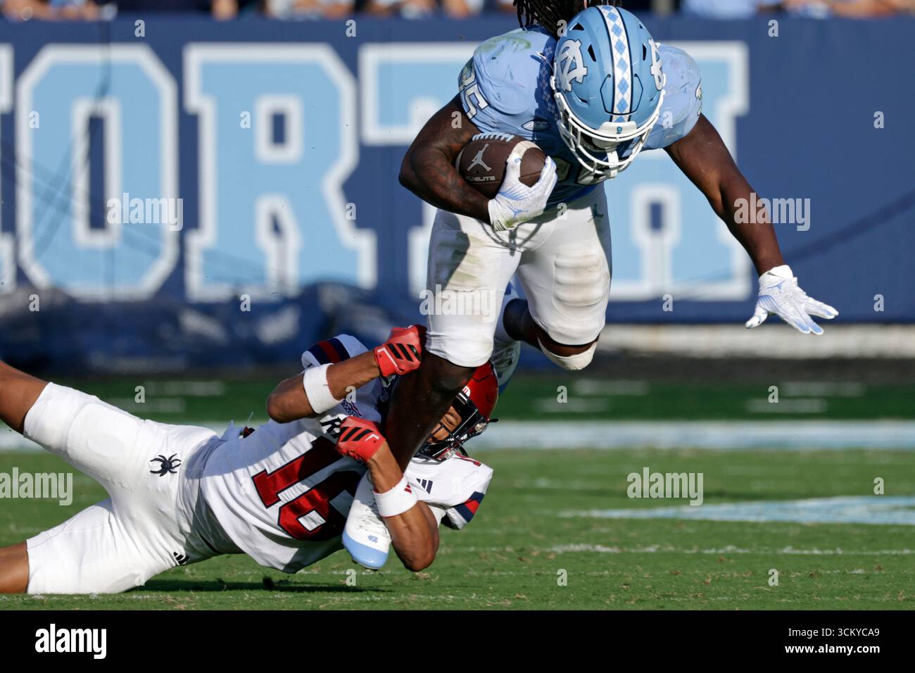 North Carolina running back Demon June (35) gets tackled by Richmond ...
