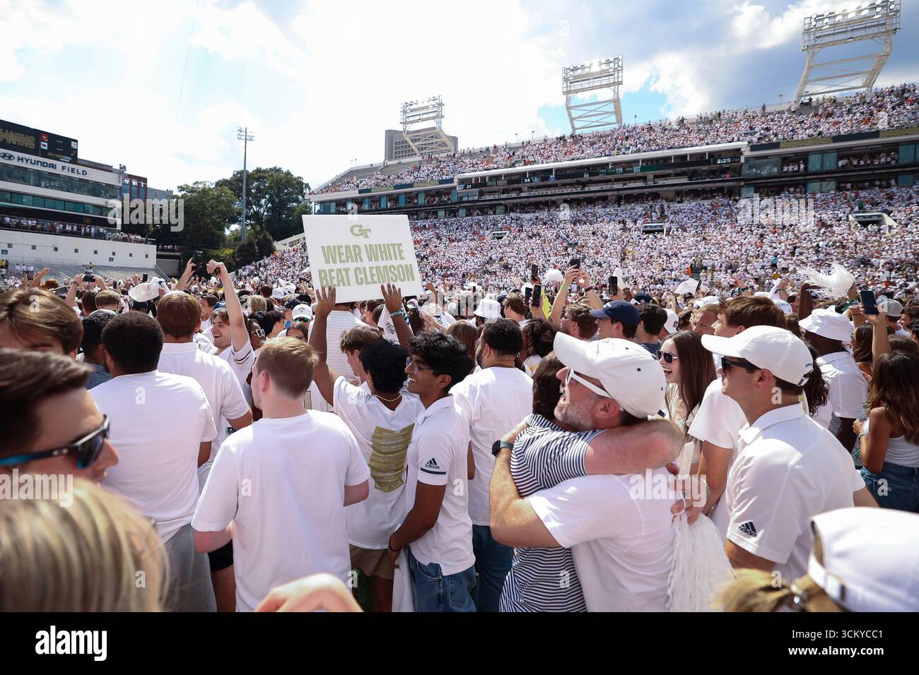 Fans storm the field after an NCAA college football game between ...