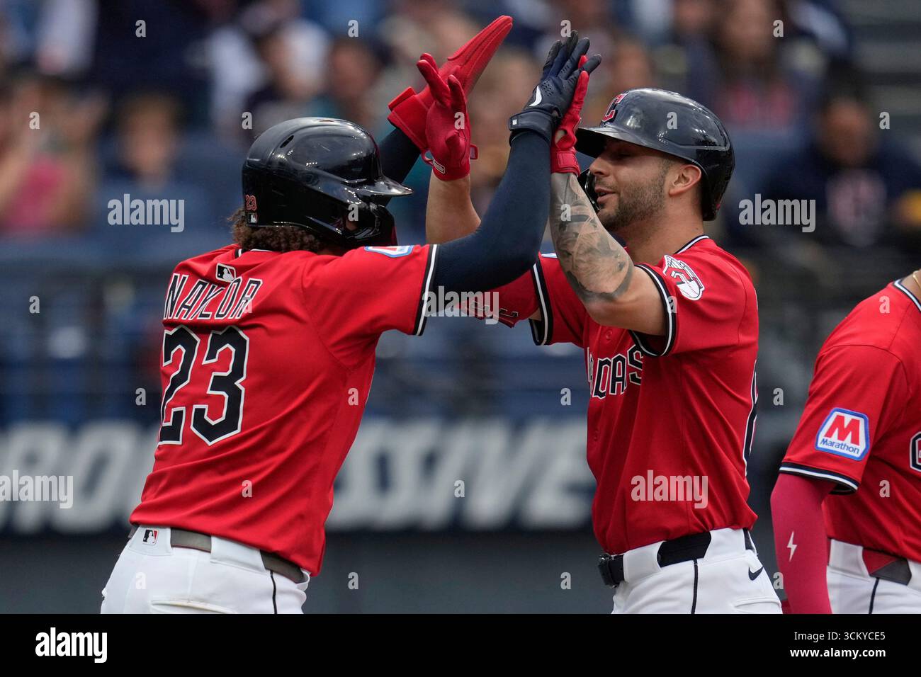 Cleveland Guardians' CJ Kayfus, right, is greeted at the plate by ...