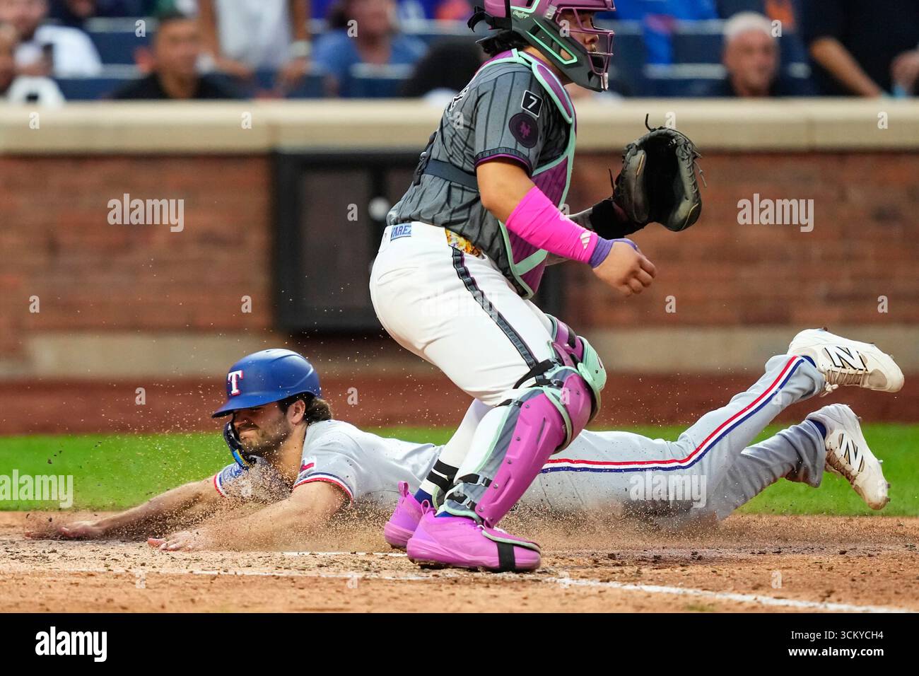 Texas Rangers' Josh Smith slides into home plate safely during the ...