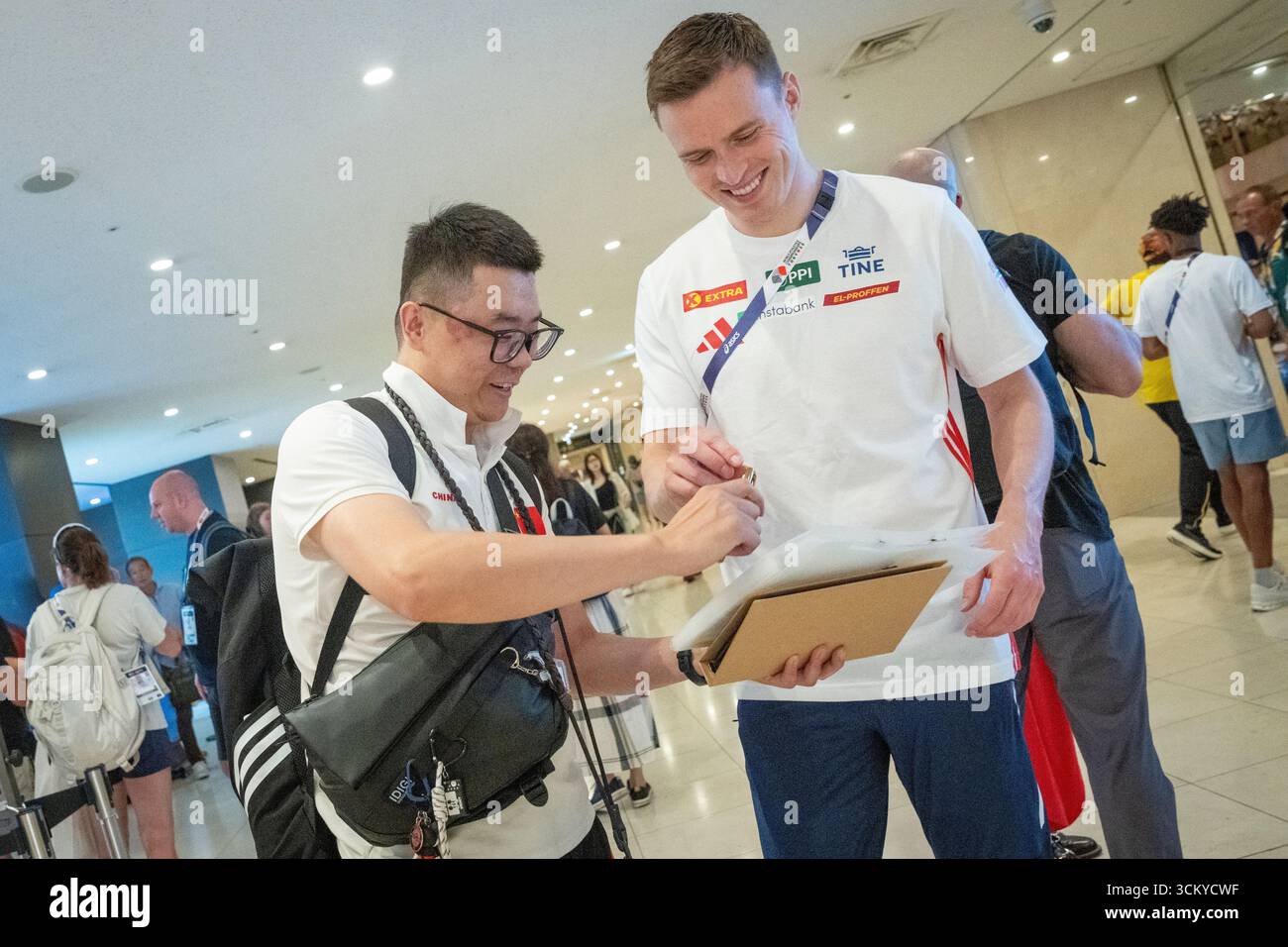 Tokyo, Japan 20250913. Karsten Warholm gives an autograph to a Japanese fan at the athlete's ...